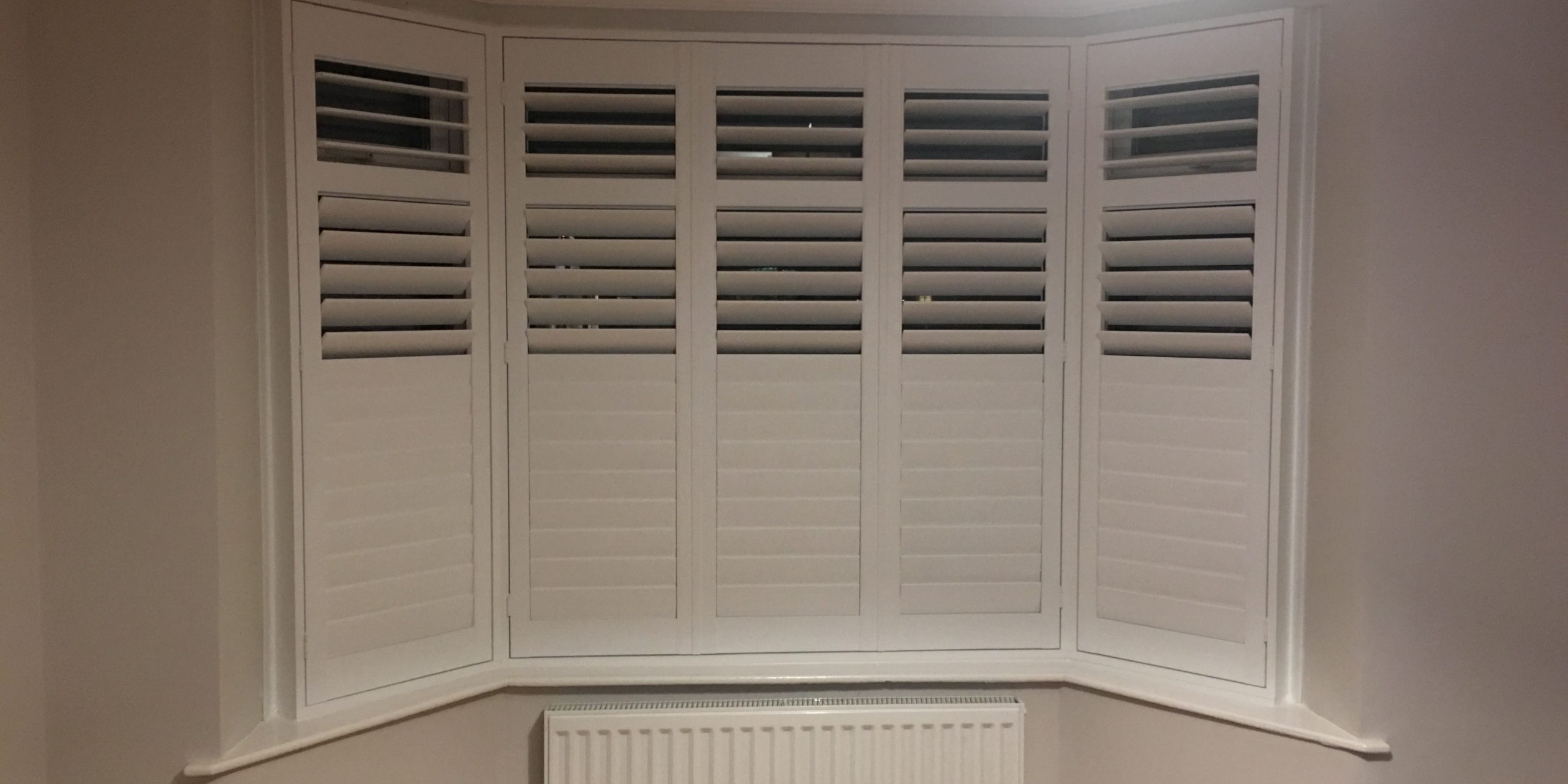 A large 3 sided bay window plantation shutter installation in Salford | Absolute Shutters