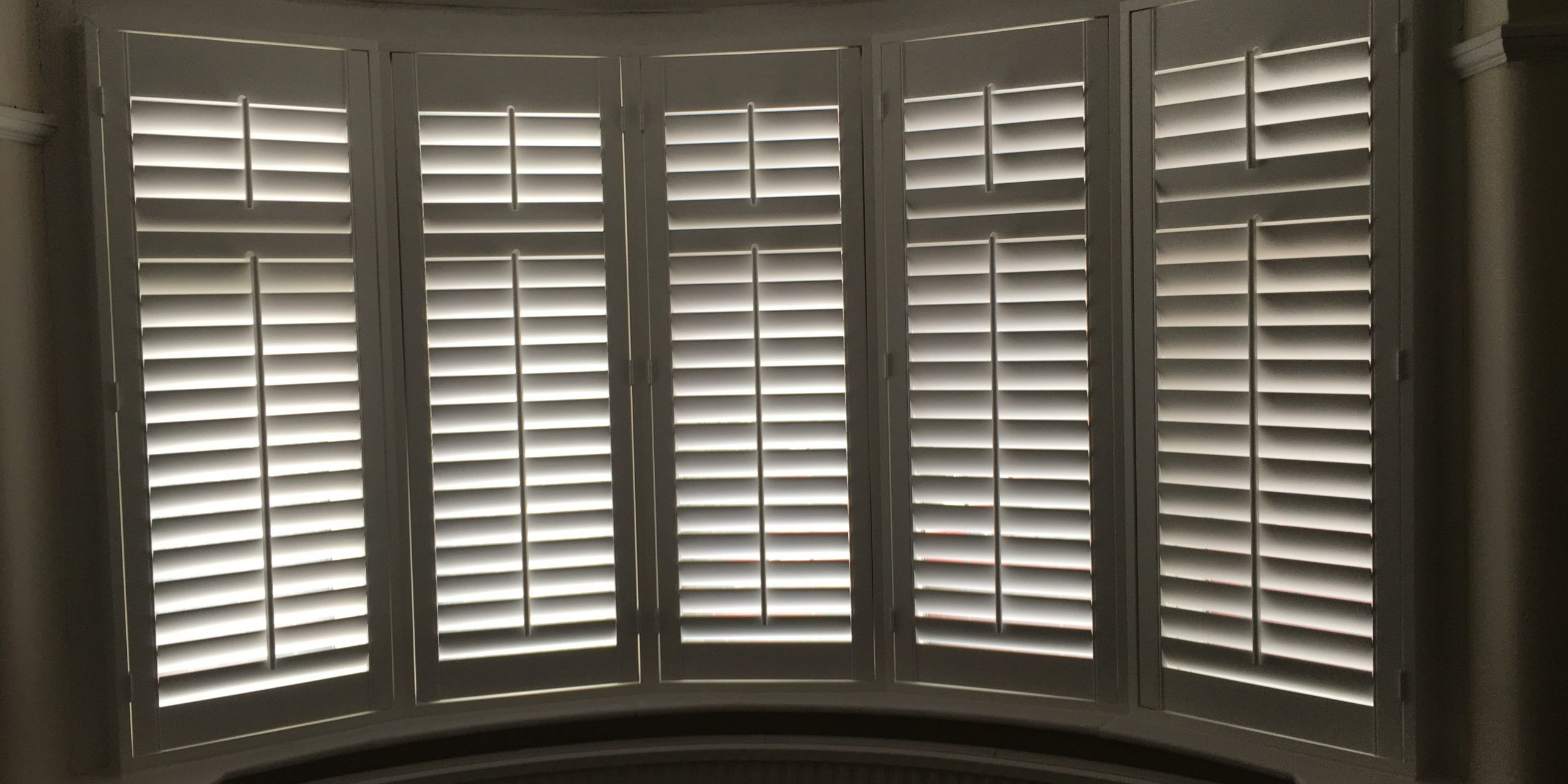 A curved bay window installation in Wilmslow | Absolute Shutters